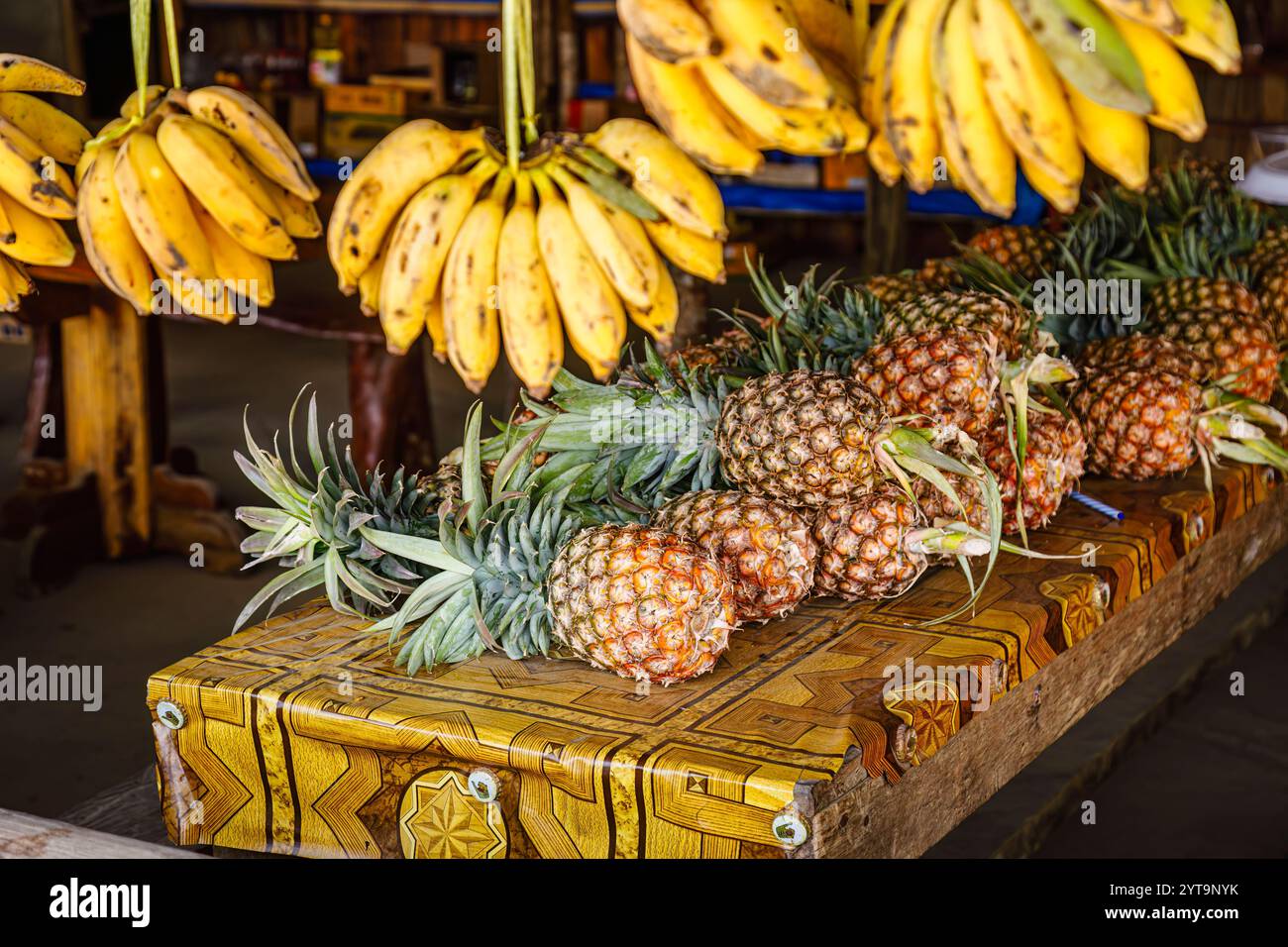 Fruit (bananas and pineapples) in a roadside shop, Ban Pha Lam Phen ...