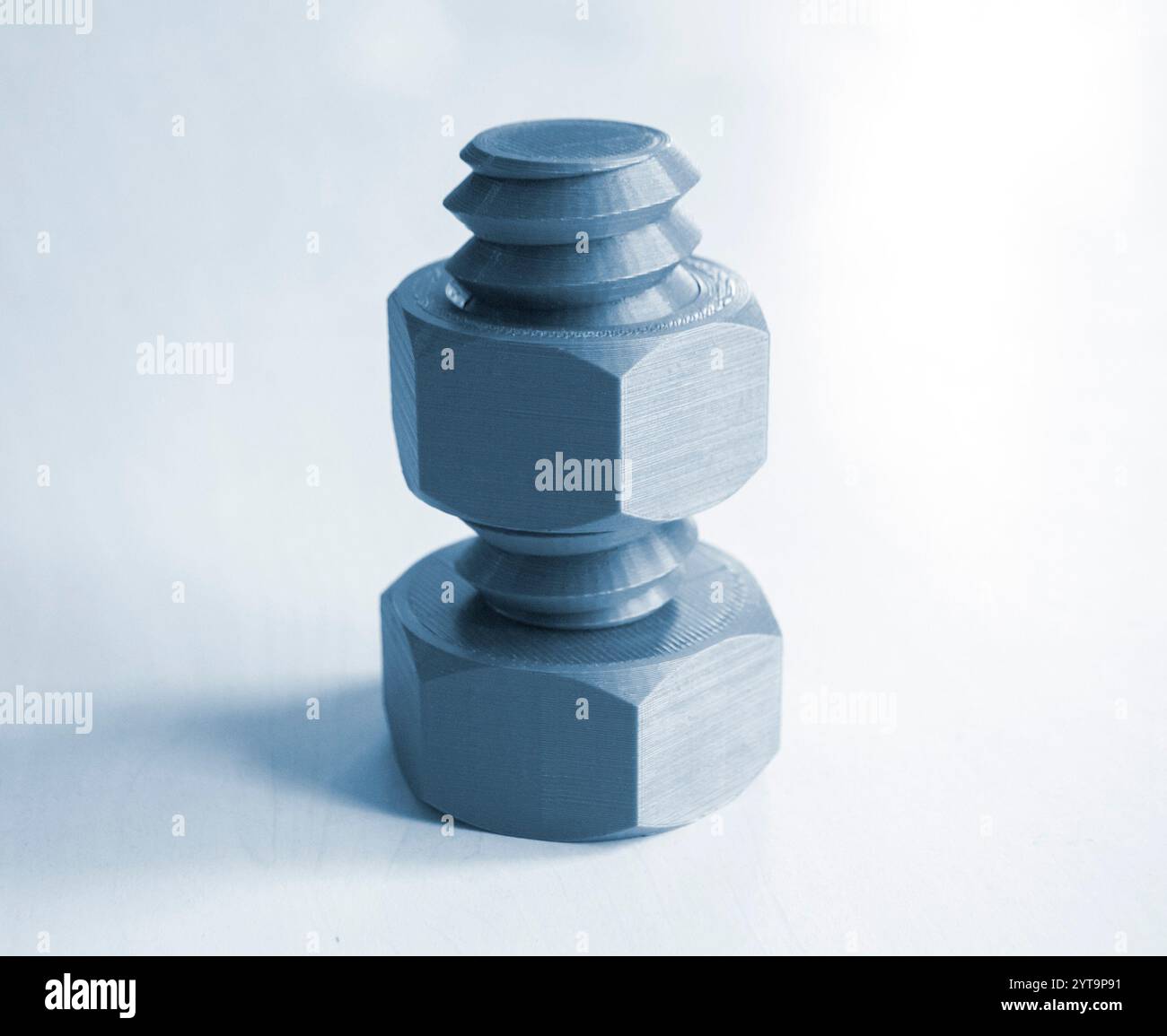 Object in form of washer and bolt printed on 3D printer. Three ...