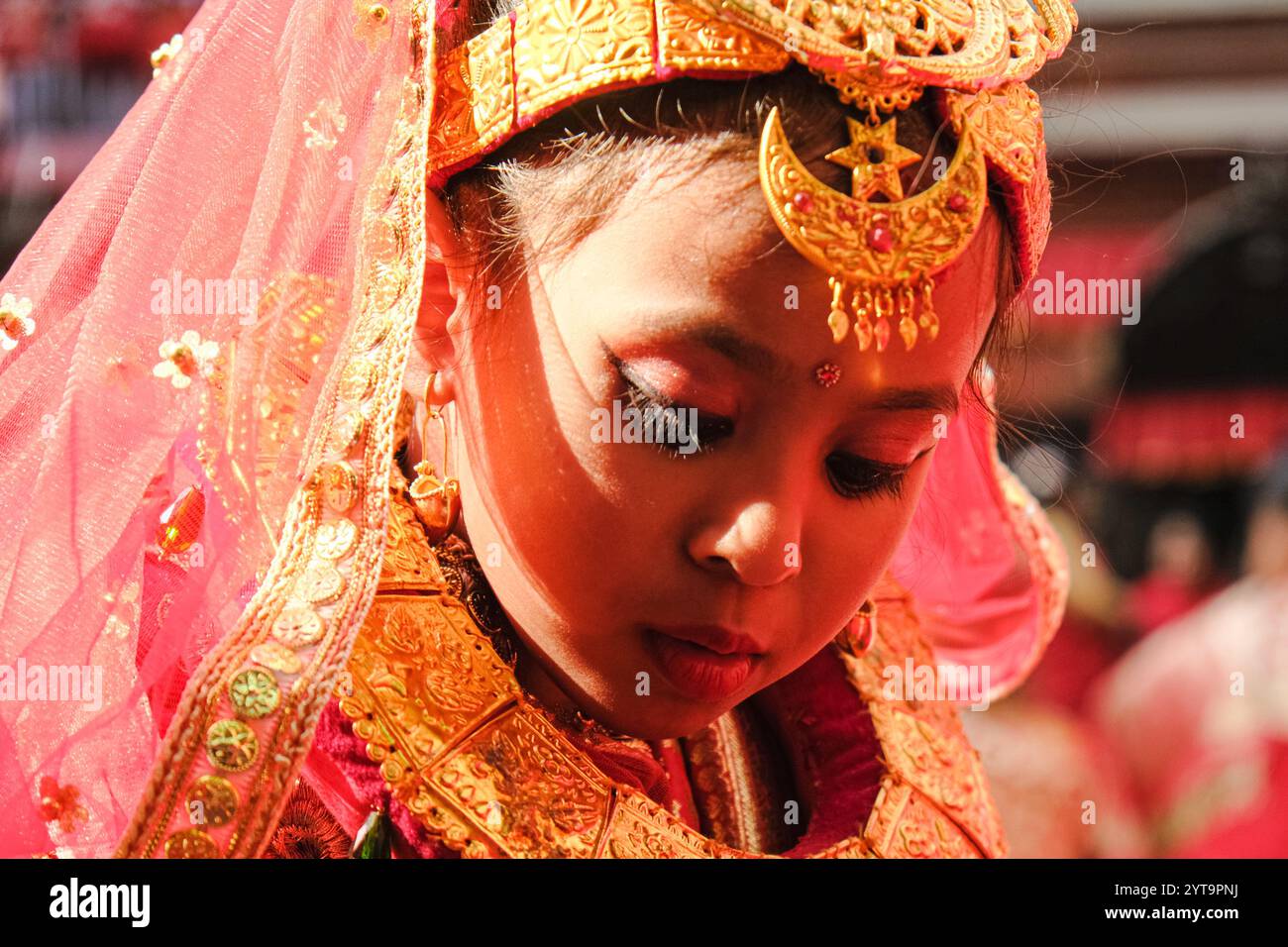 Thamel, Nepal. 6th Dec, 2024. A teen Newari girl dresses in traditional ...