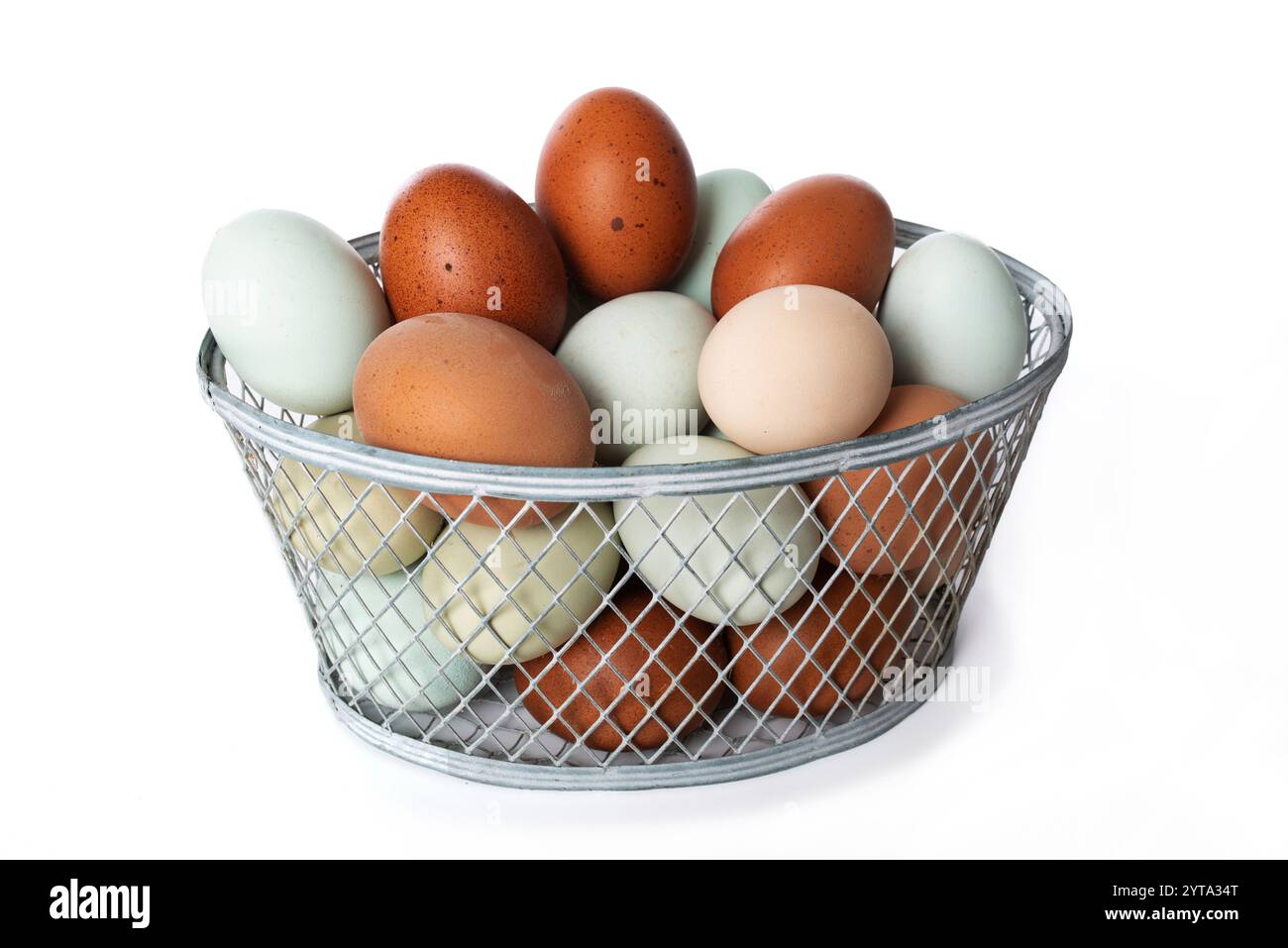 Many chicken eggs in a basket Stock Photo - Alamy