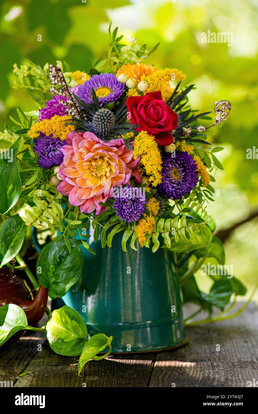 Autumn bouquet in an old enamel pot Stock Photo - Alamy