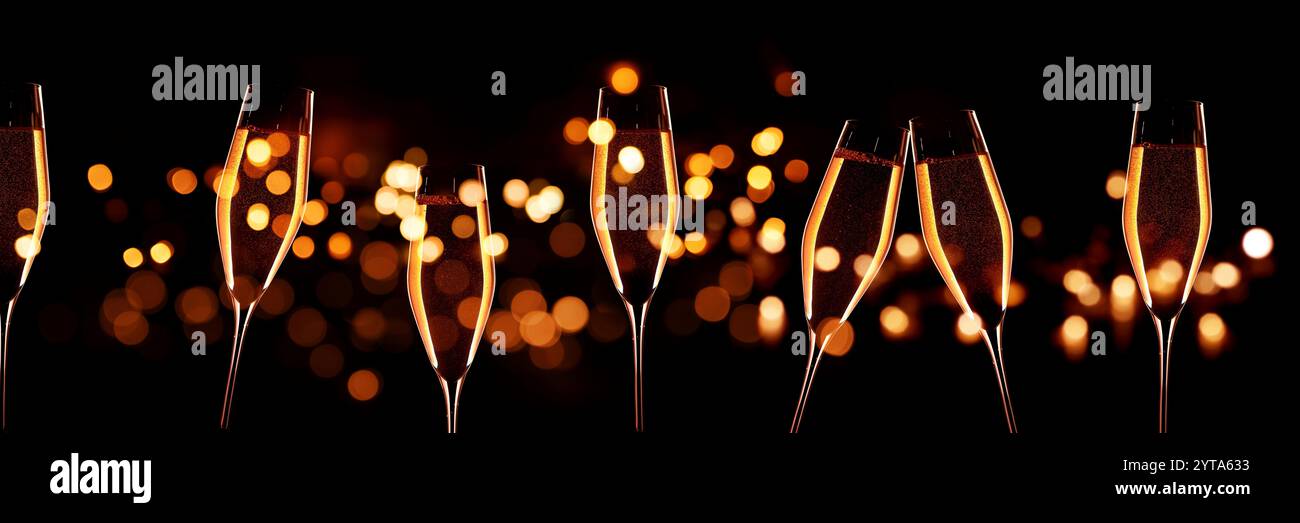 Cheers with champagne and golden bokeh on black background. Horizontal ...