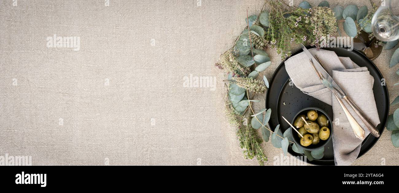 Mediterranean table setting with olives, decorated in natural boho ...