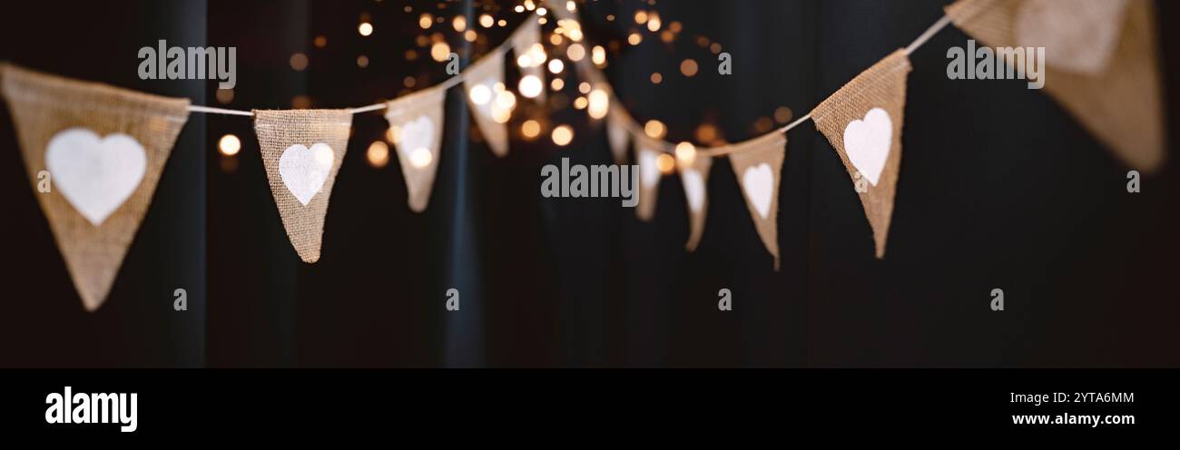 Hanging outdoor party string in boho style with hearts and golden ...