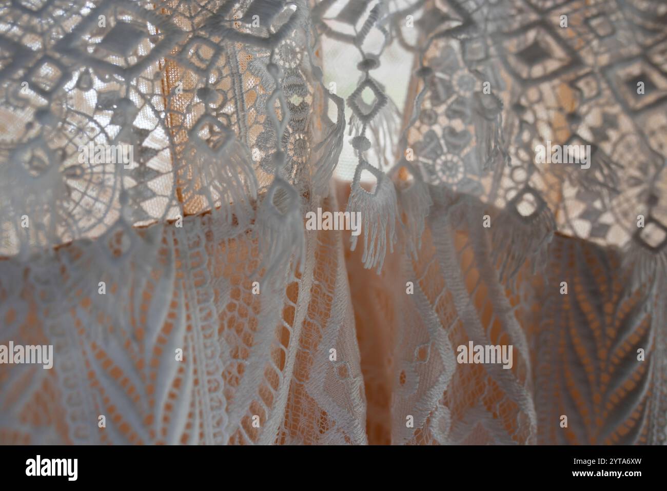 Wedding dress made of lace and silk. Detail shot of an elaborate ...