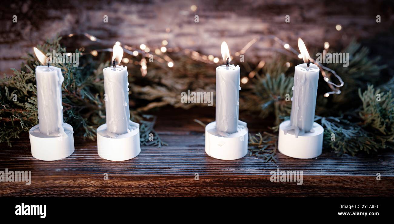 Homemade advent decoration with four burning candles and magical lights ...