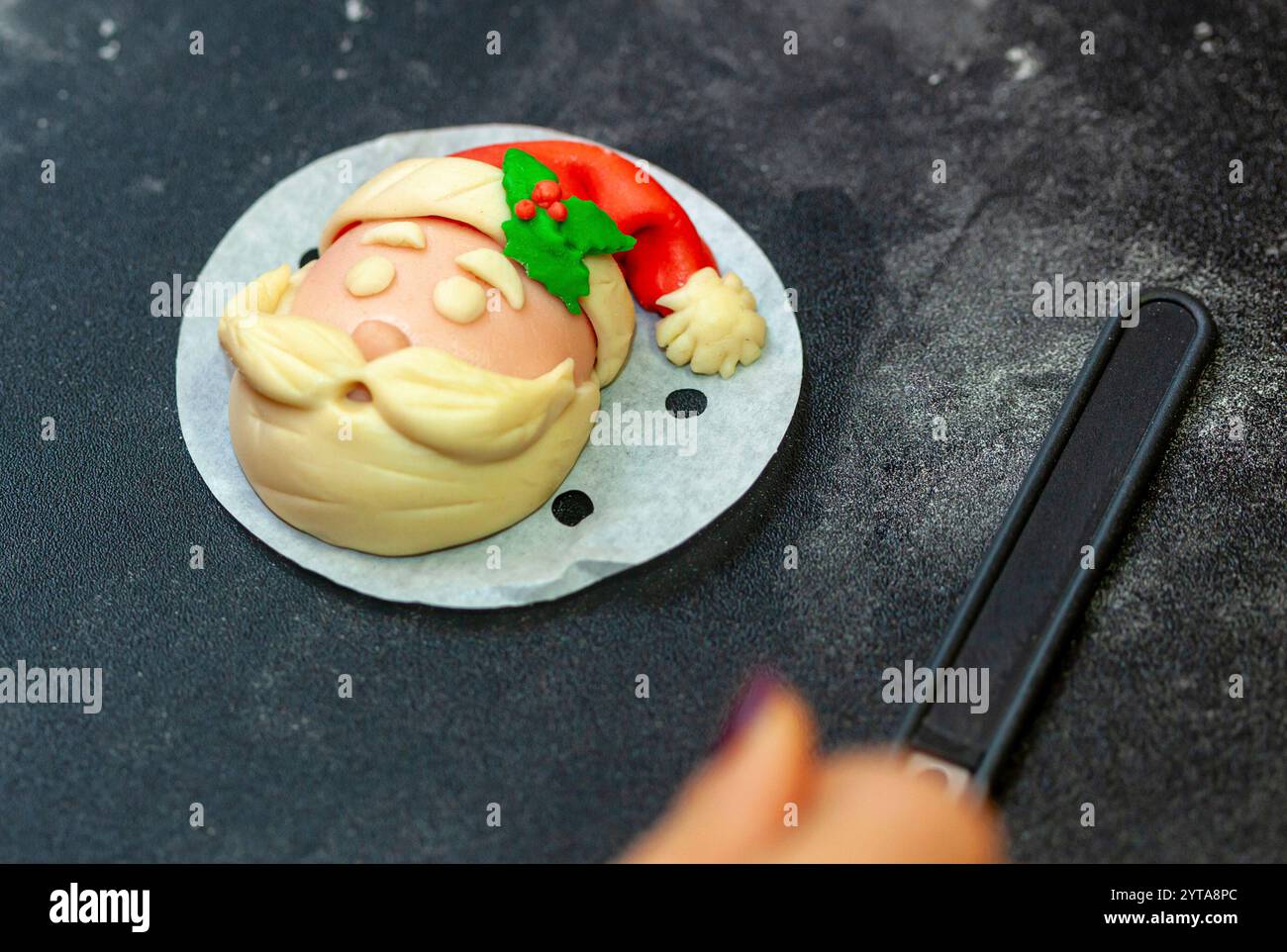 Preparation of steamed sandwich in the shape of Santa Claus Stock Photo ...