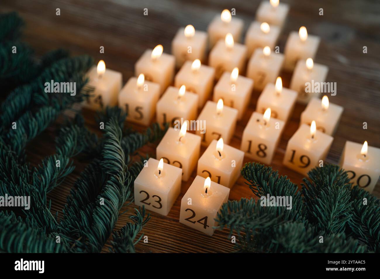 Advent calendar made of twenty four burning candles. Homemade candles ...
