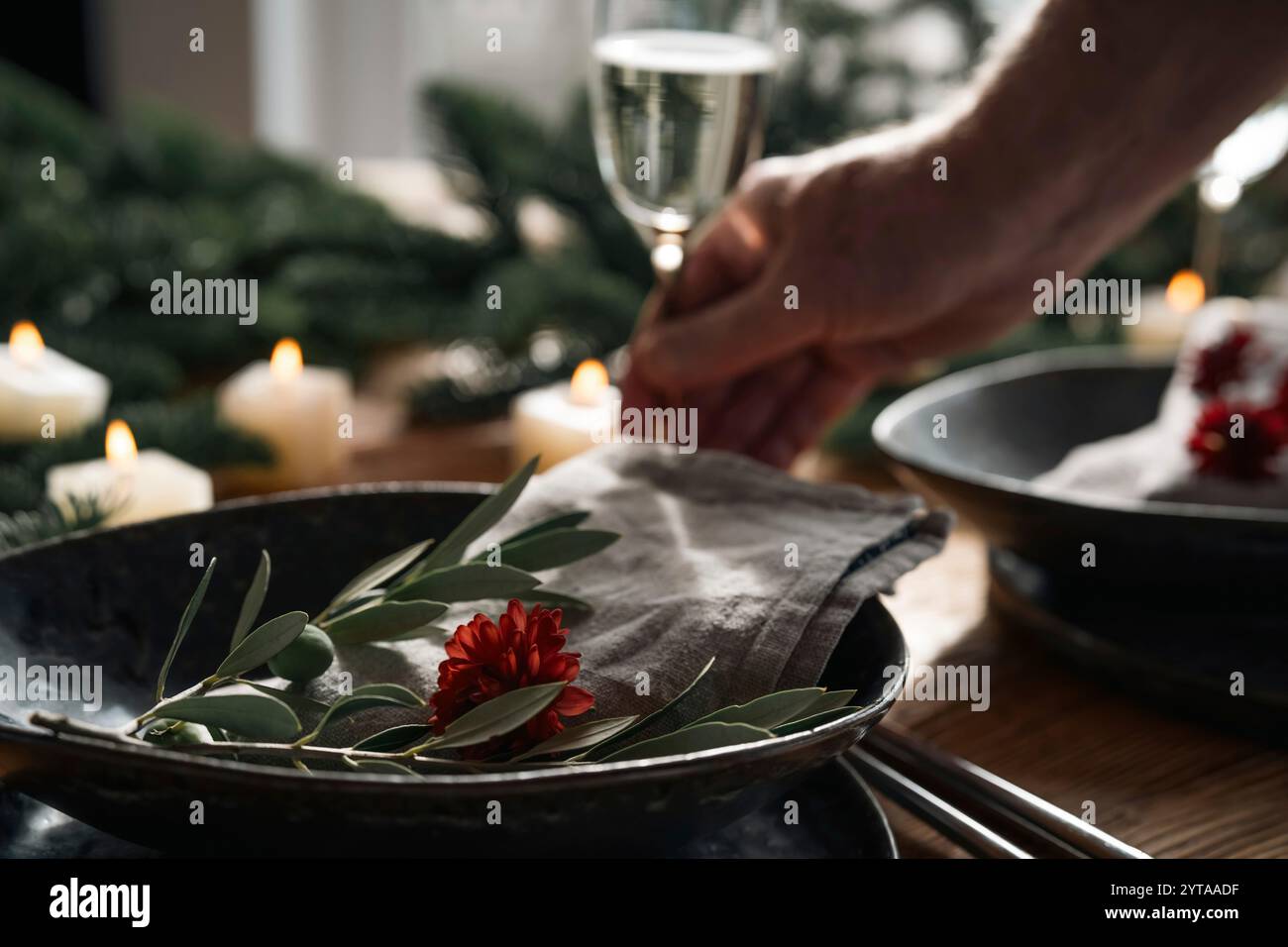 Table decoration for festive occasions with hand holding a champagne ...