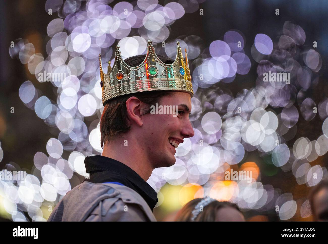 A fan waits in line to enter B.C. Place stadium for the opening night ...