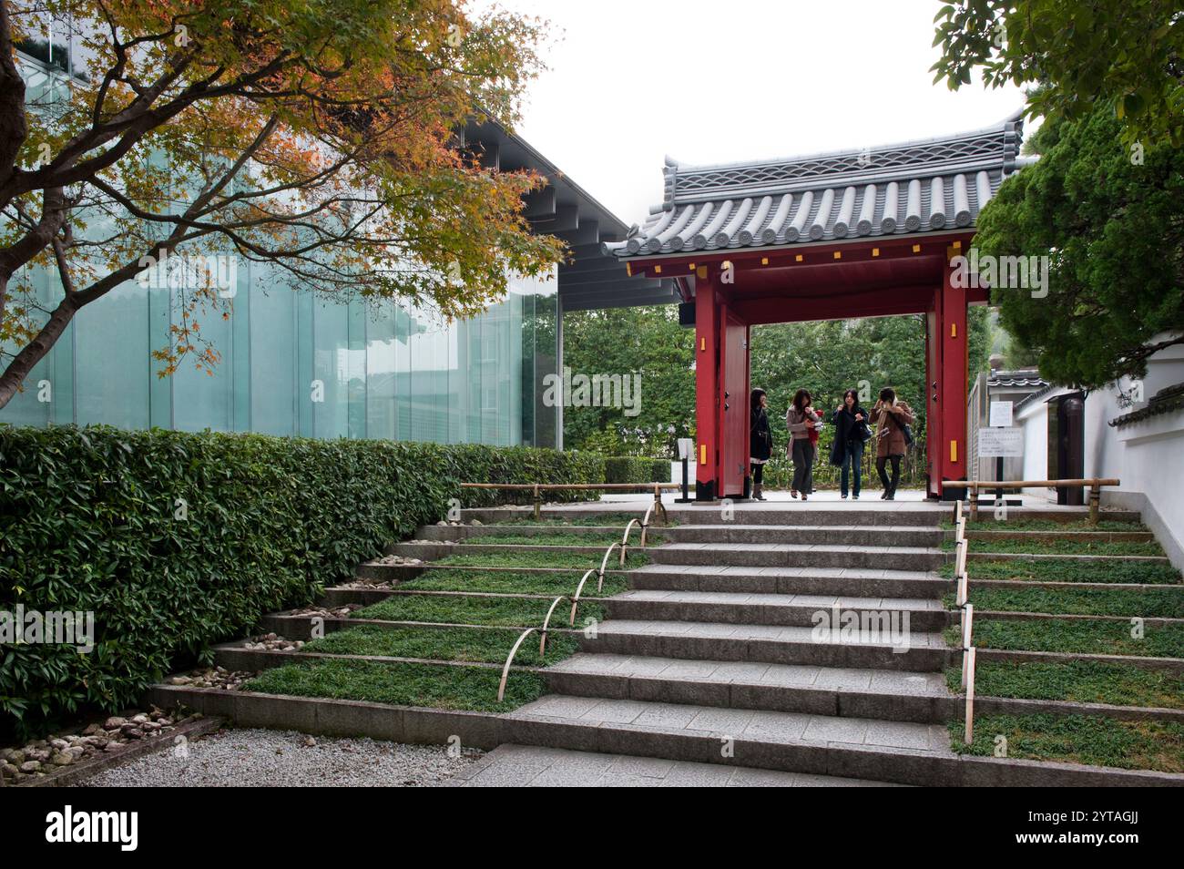Visitors leaving the Byodo-in Hoshokan Museum through the Nammon South ...