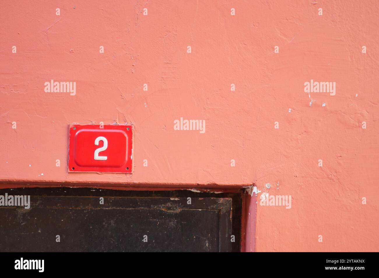 Door Number 2 beautifully placed on an eyecatching Pink Wall Stock ...