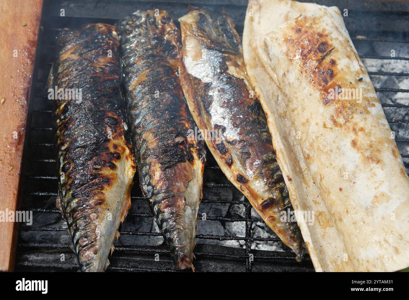 Baking and roasting fish on barbecue grill Stock Photo - Alamy