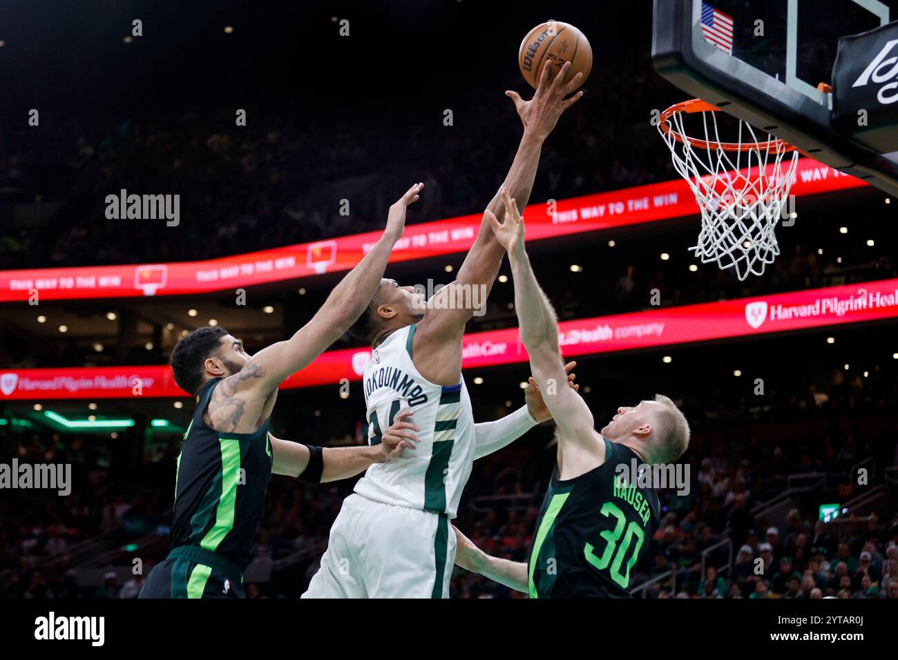Milwaukee Bucks forward Giannis Antetokounmpo, center, drives to the ...