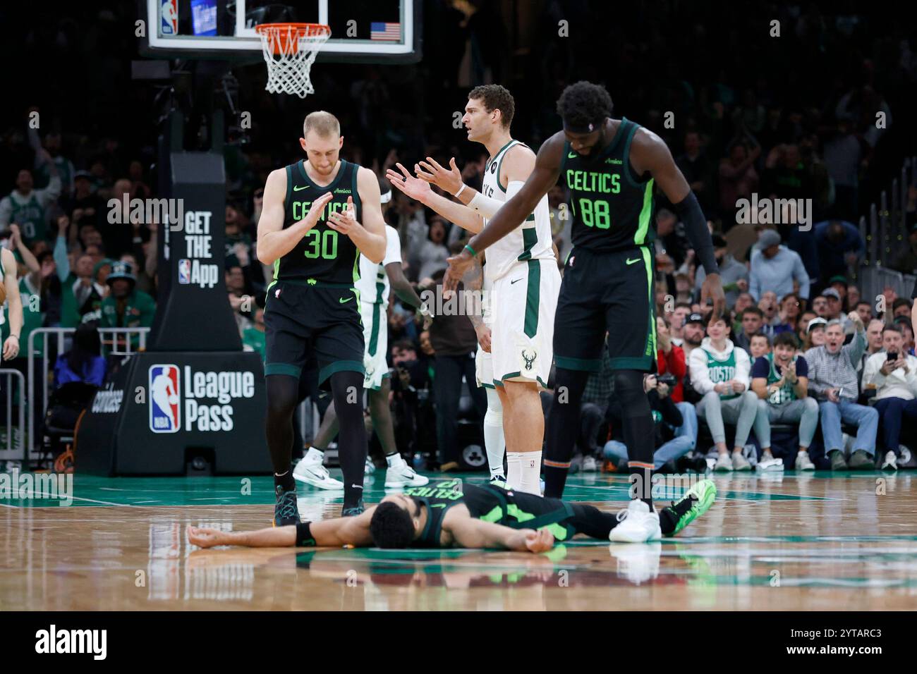 Milwaukee Bucks center Brook Lopez, top center, Boston Celtics forward ...