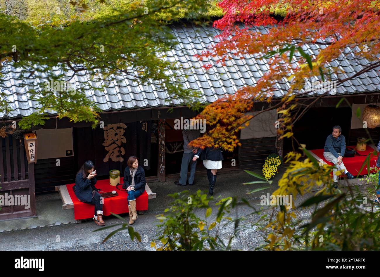 Two women enjoying a relaxing autumn tea break at the famous historic ...