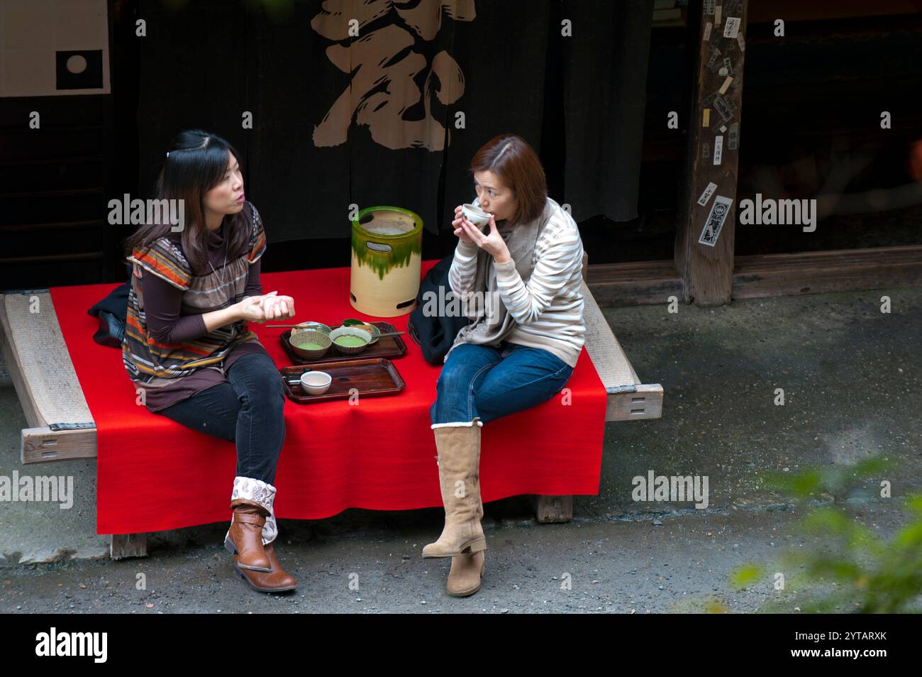 Two women enjoying a relaxing autumn tea break at the famous historic ...