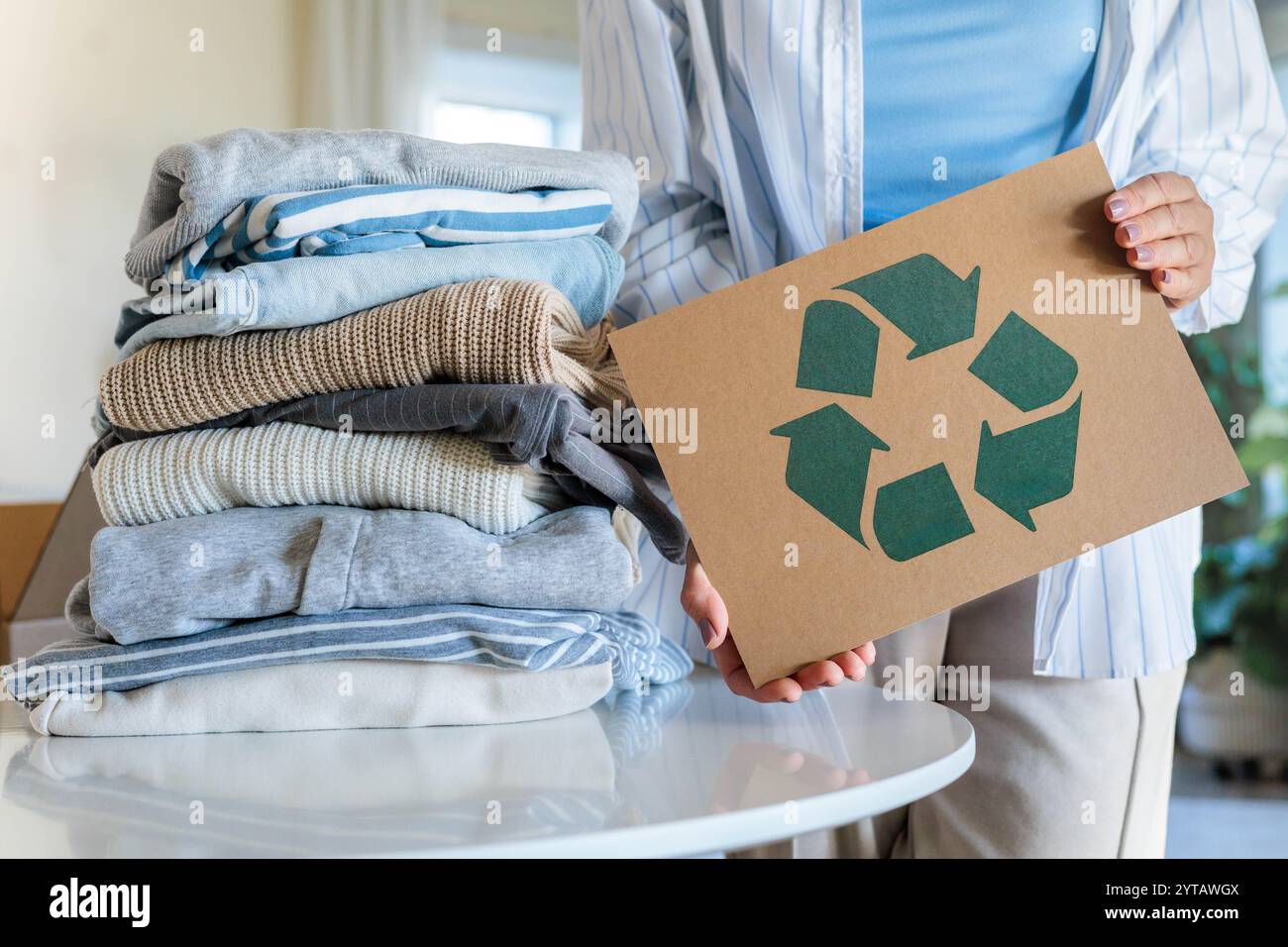 Female hands holding signboard textile clothes recycling reusing zero ... Female hands holding signboard textile clothes recycling reusing zero ...