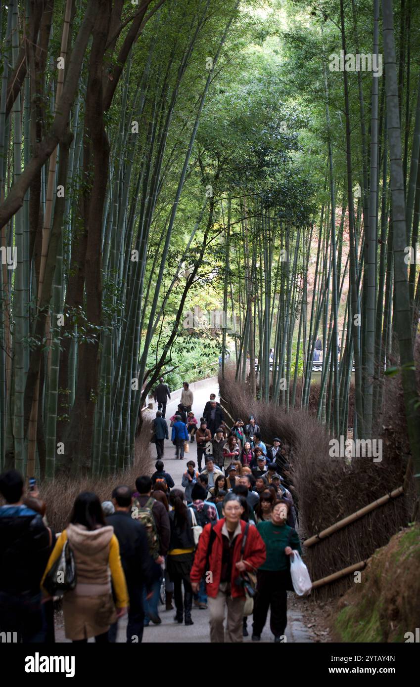Tourists crowding the famous Arashiyama bamboo forest walkway during ...