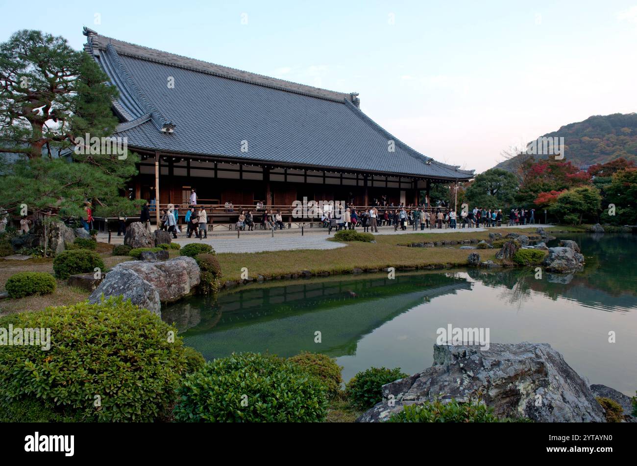 Tourists crowd the veranda of Arashiyama's Tenryuji Zen Buddhist temple ...