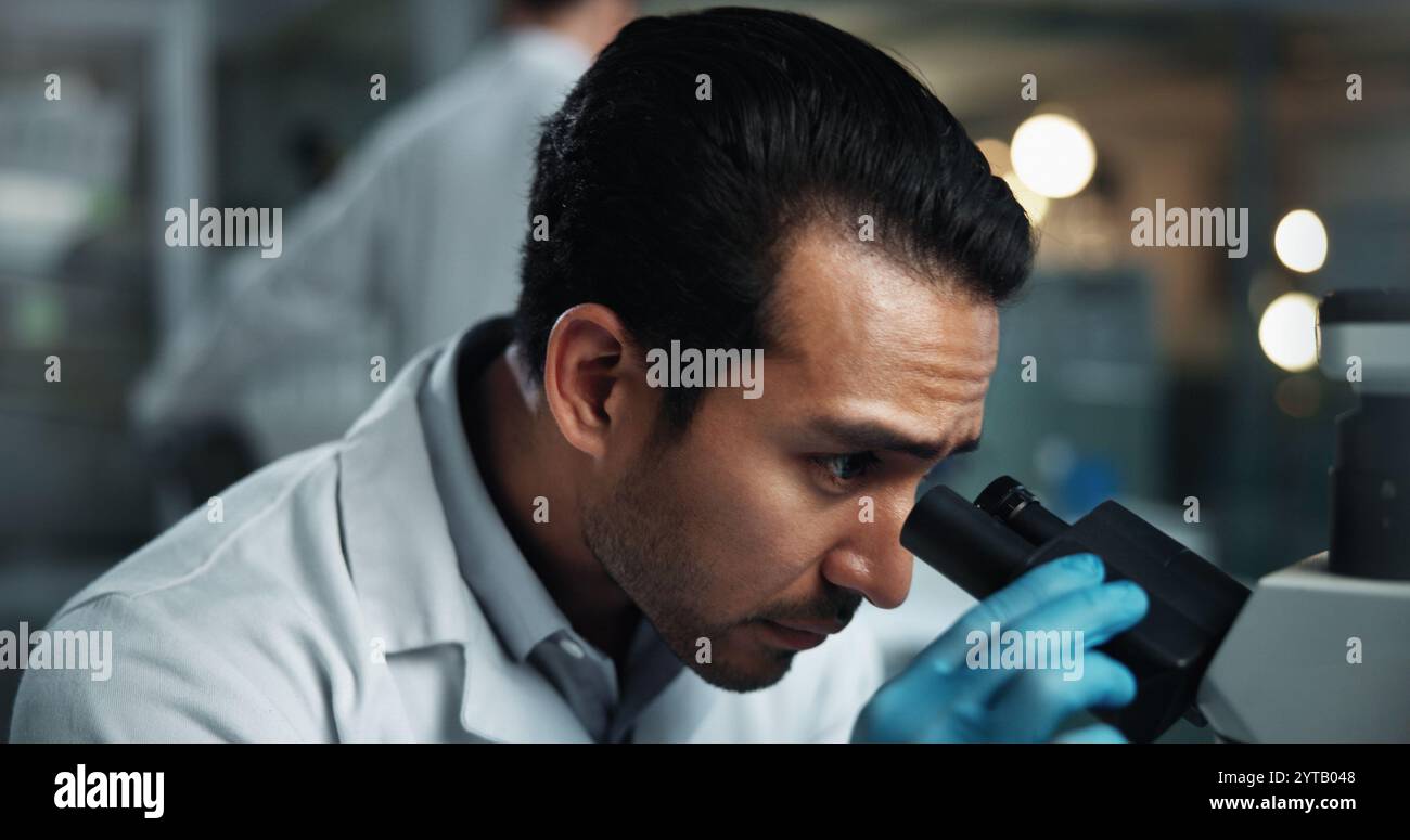 Man, microscope and scientist research in laboratory for experiment, medical analysis or ...