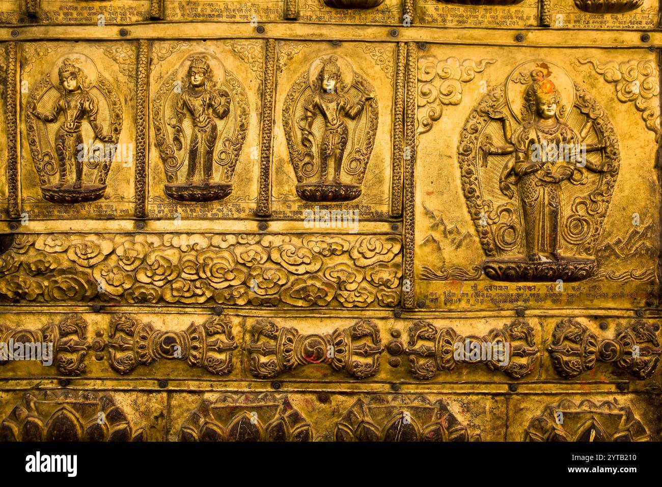 Golden ornate wall detail at Seto Machindranath Temple, also known as ...