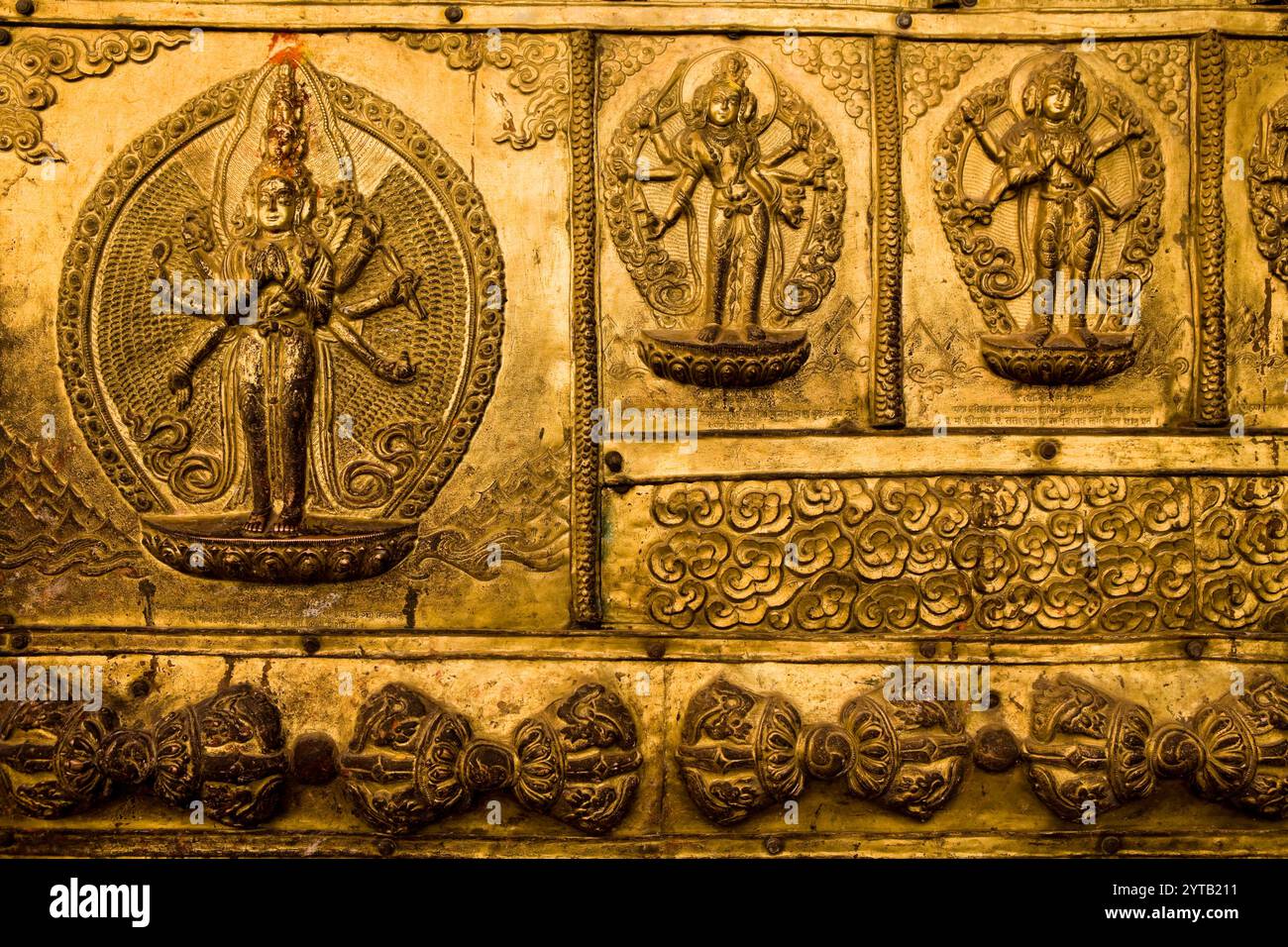 Golden ornate wall detail at Seto Machindranath Temple, also known as ...