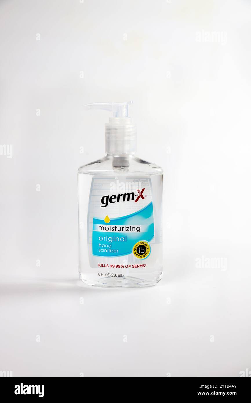 Hand sanitizer bottle with moisturizing formula placed on neutral ...