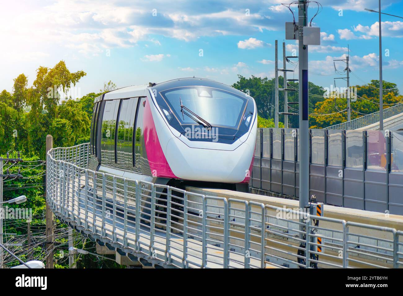 Modern high speed monorail train turn passes race station on the stage ...