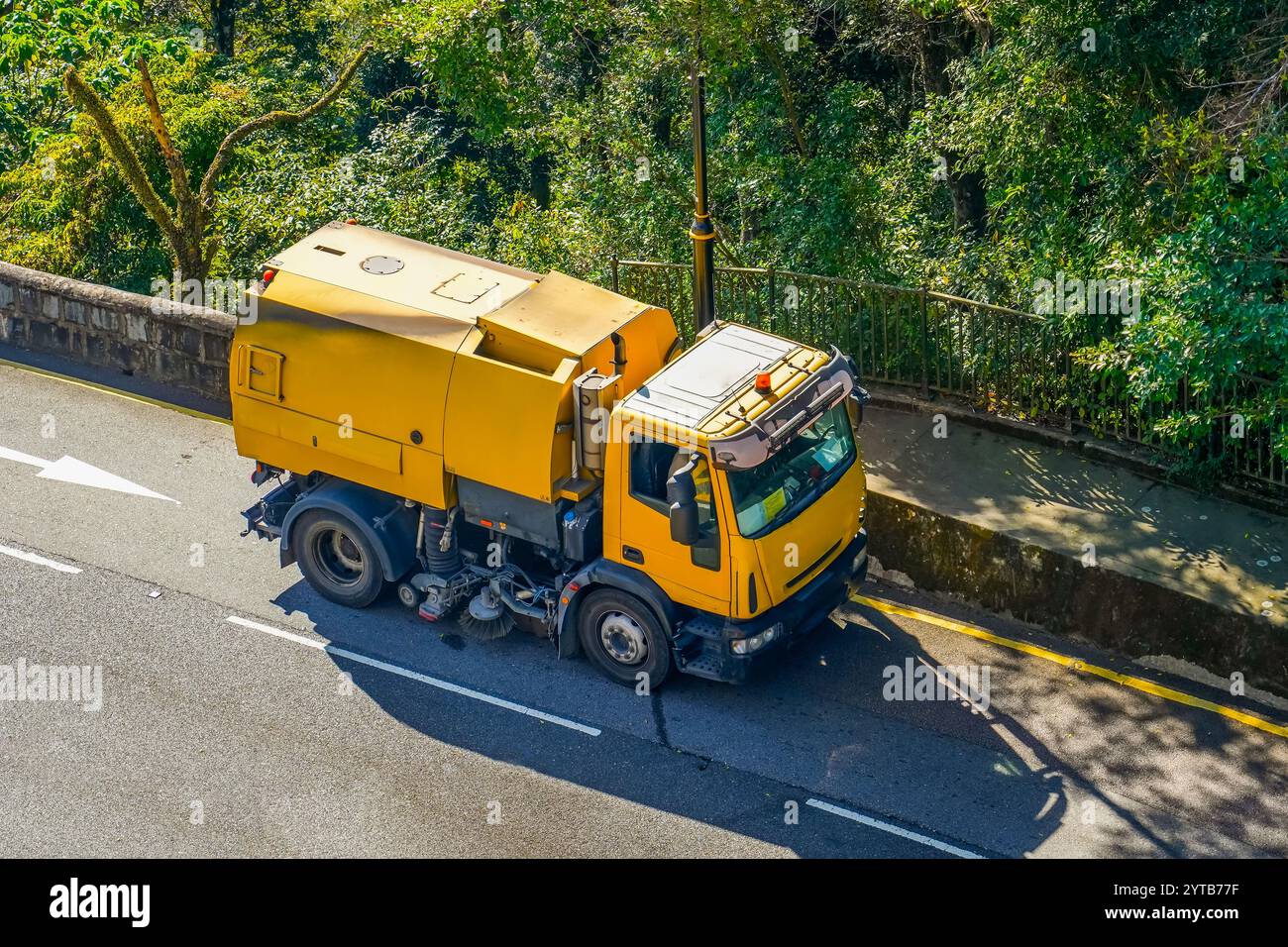 Street yellow truck sweeper sweeping the street Stock Photo - Alamy