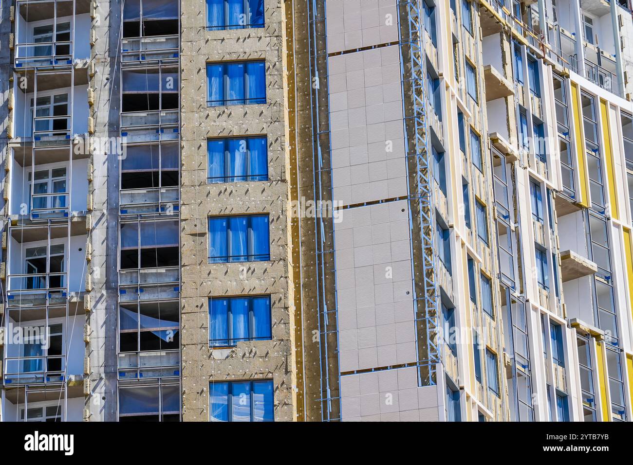 Sheathing of the outer wall of a brick building with insulation ...