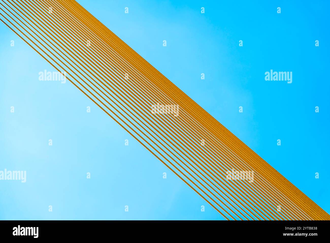 Diagonal lines of metal steel cables of supports for a bridge in the ...