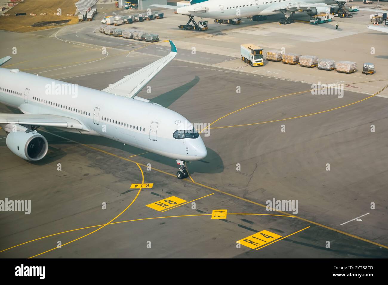 Aerial view of the airport road markings signs on the surface. Airplane ...