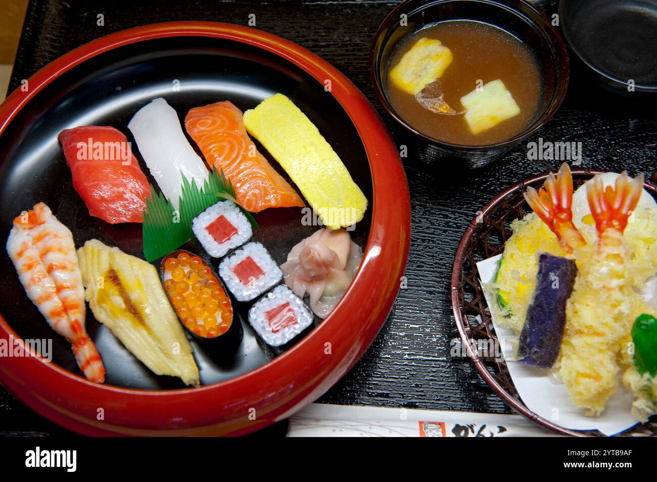 A plastic replica of sushi and tempura meal set on display in a ...