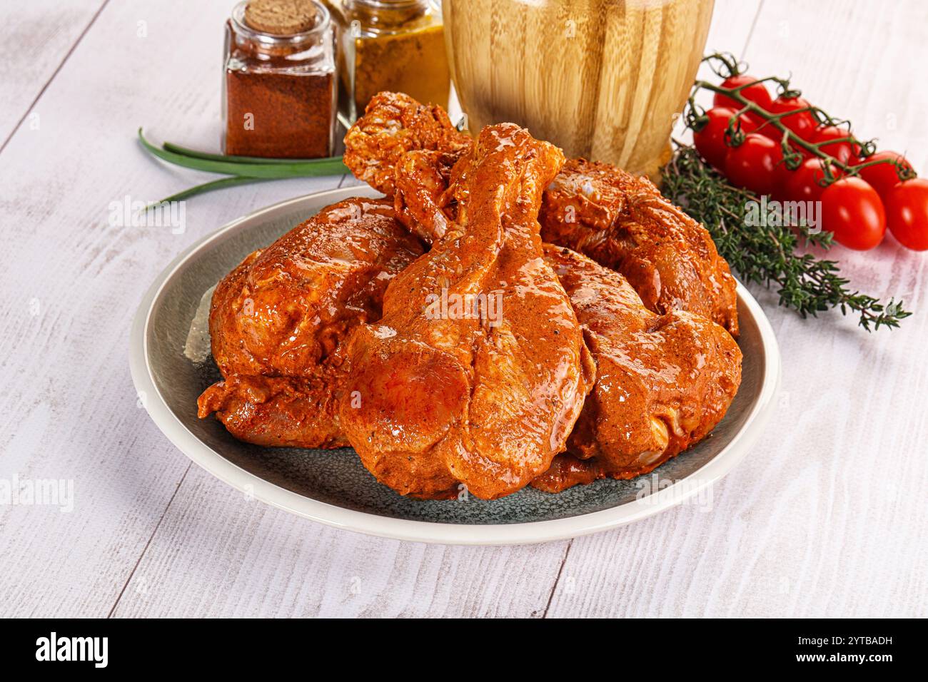 Raw turkey shoulder wing in Indian tandoori marinade spices Stock Photo ...