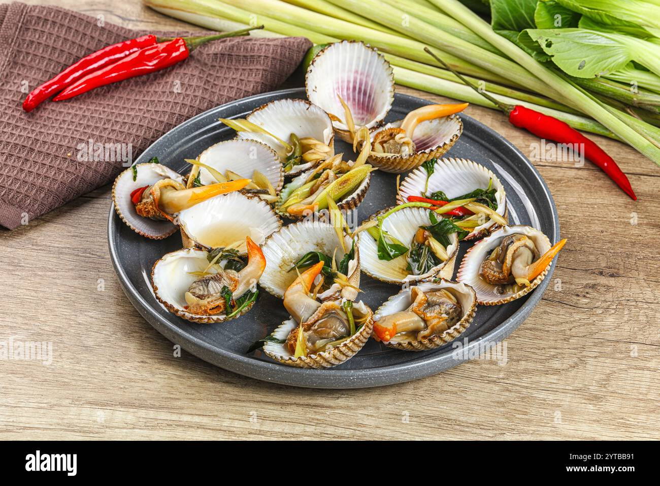 Delicous Asian mollusk shell steamed with spices Stock Photo - Alamy