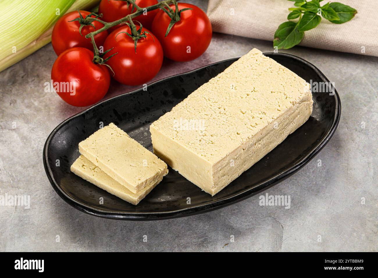 Soya vegan tofu cheese brick over board Stock Photo - Alamy