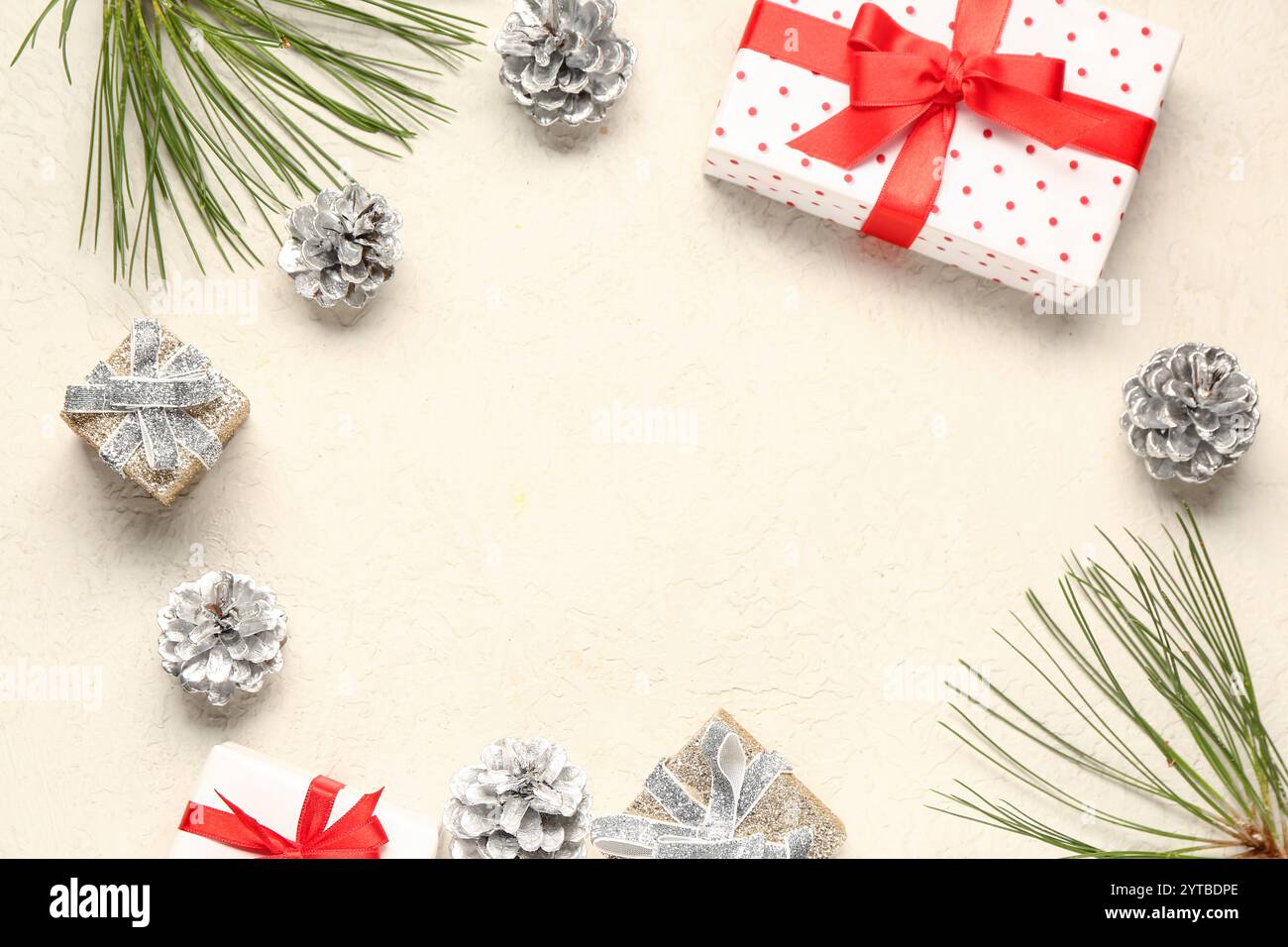 Frame made of pine cones, gift boxes and branches on light background Stock Photo - Alamy