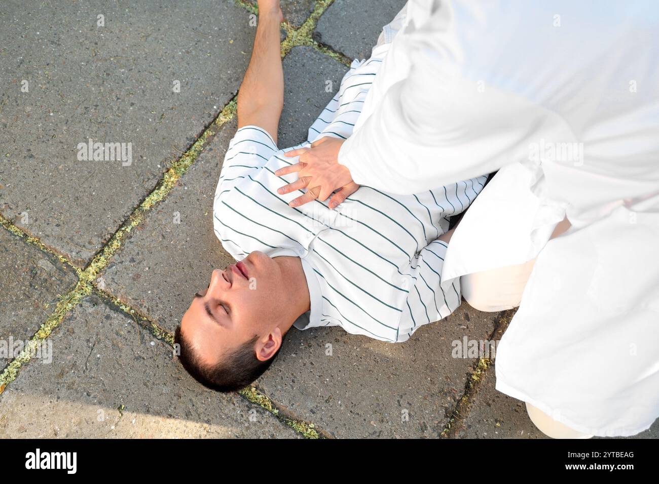 Unconscious woman on ground hi-res stock photography and images - Alamy