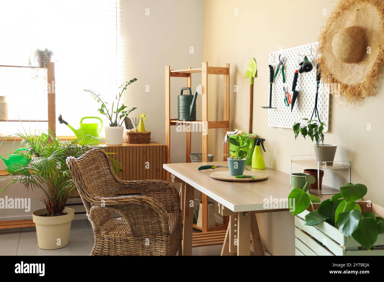 Interior of workshop with gardening tools, pegboard and workplace Stock ...