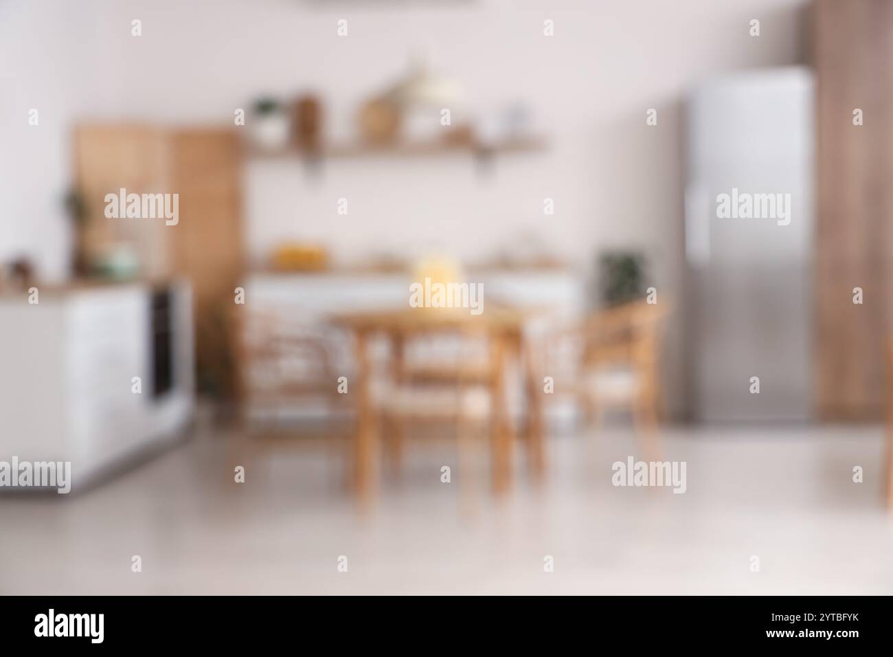 Modern interior of kitchen with dining table. Blurred view Stock Photo ...