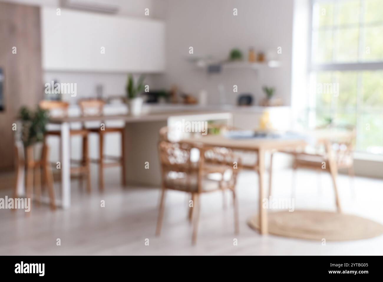 Modern interior of kitchen with dining table. Blurred view Stock Photo ...