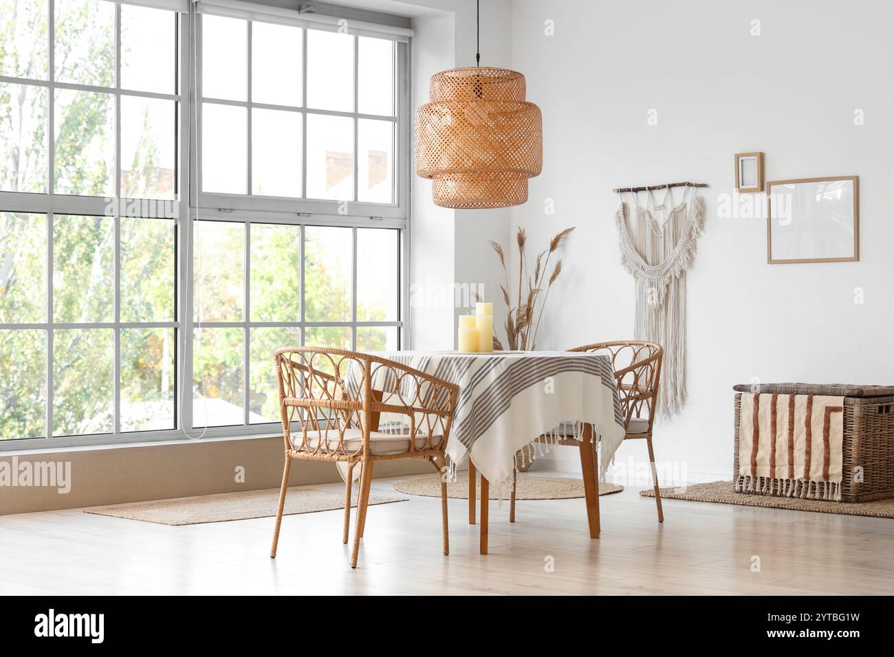 Candles on round table in modern dining room Stock Photo - Alamy