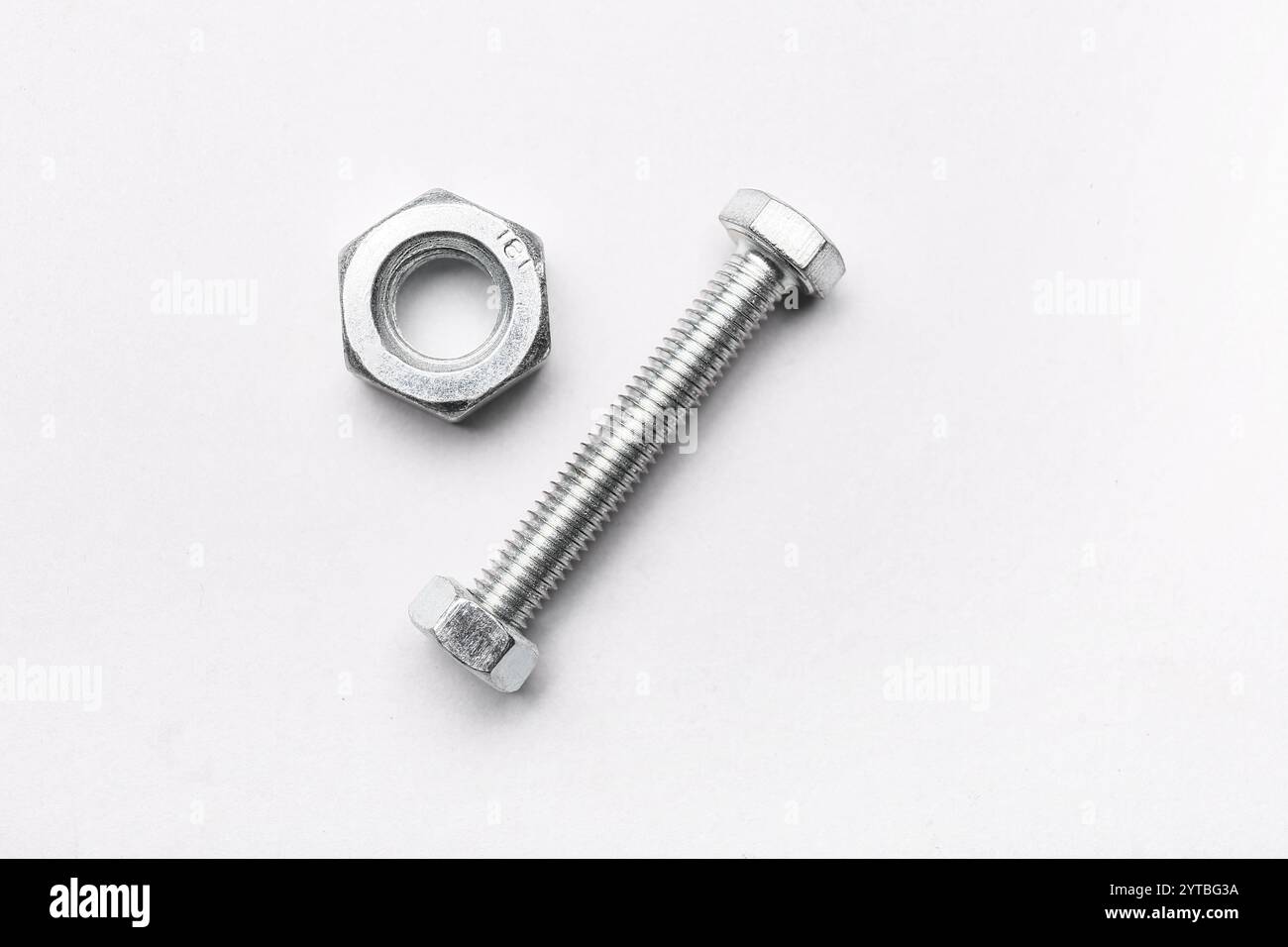 Tap bolt with chrome nuts isolated on white background Stock Photo - Alamy