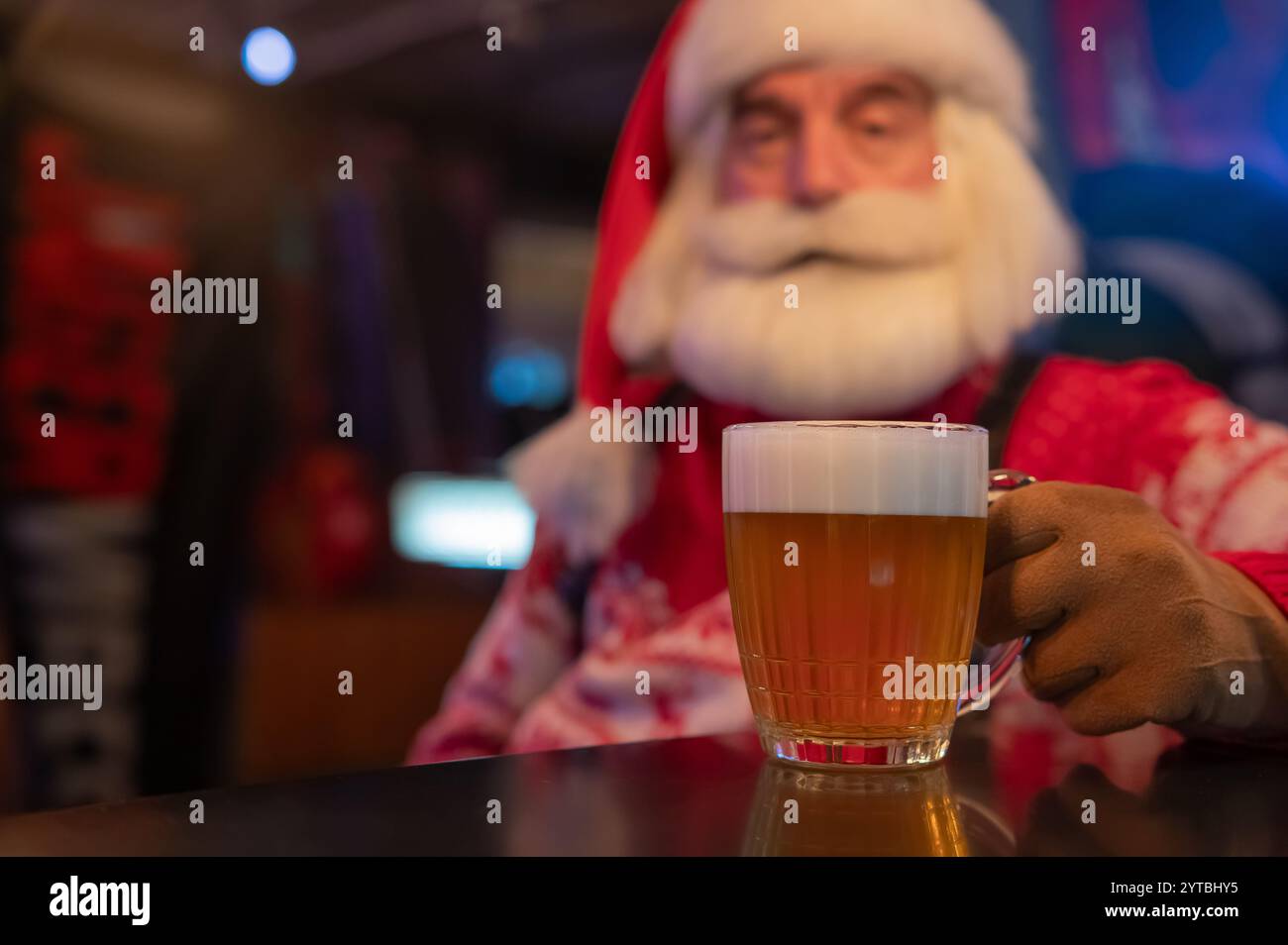 Santa Claus drinking beer at a bar Stock Photo - Alamy