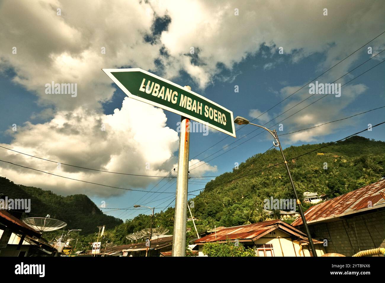 A roadsign pointing to the underground coal mining tunnel in Sawahlunto ...