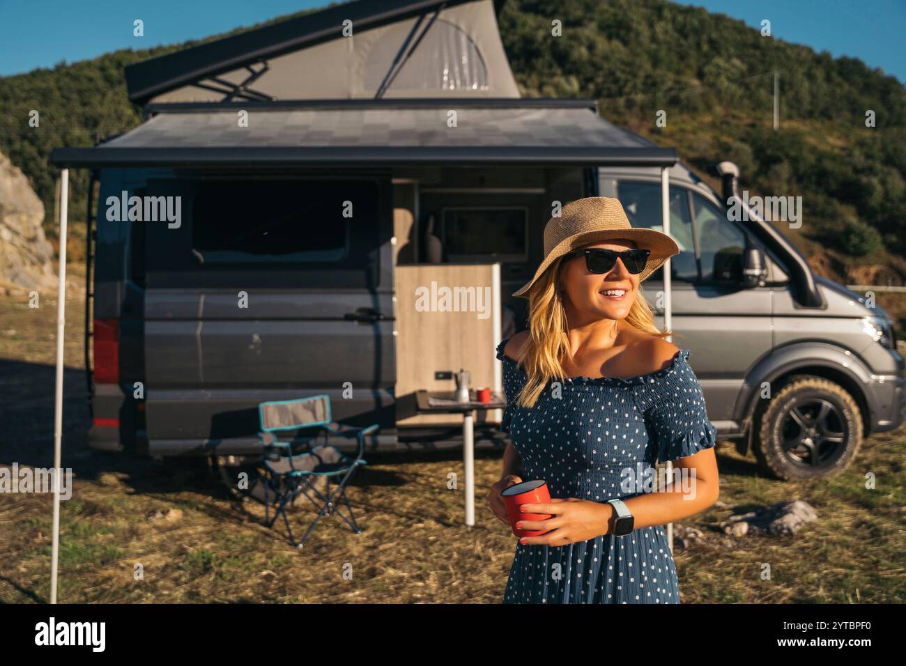 Adventurous woman in van exploring outdoor locations in a modern and ...