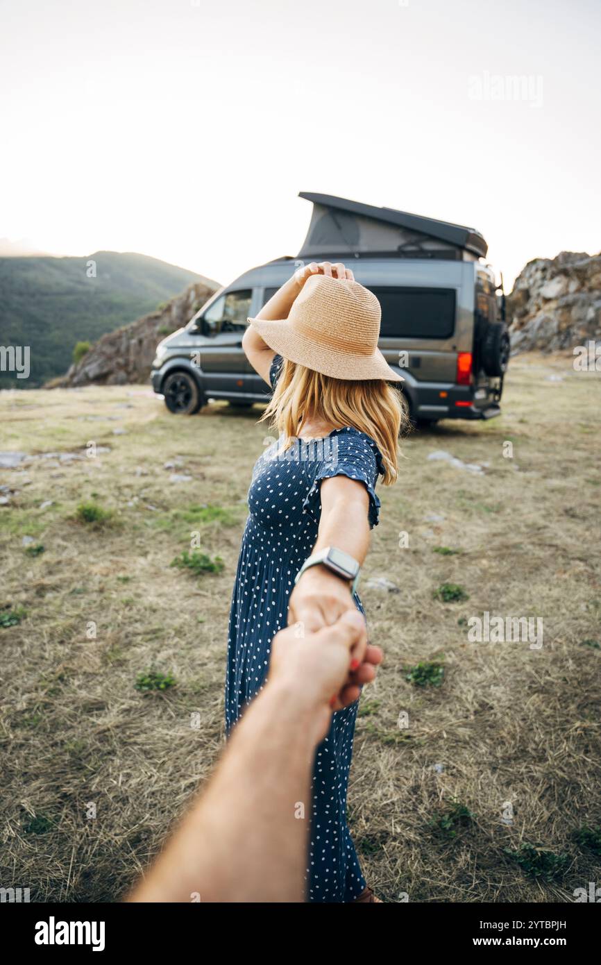 Romantic journey for a couple in a camper van amid stunning mountain ...