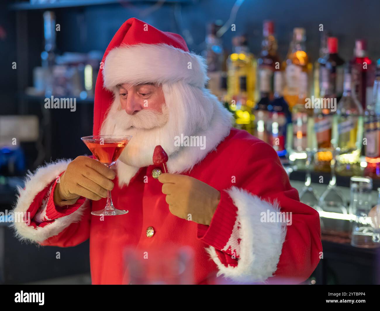 Santa Claus drinking a cocktail at a bar Stock Photo - Alamy