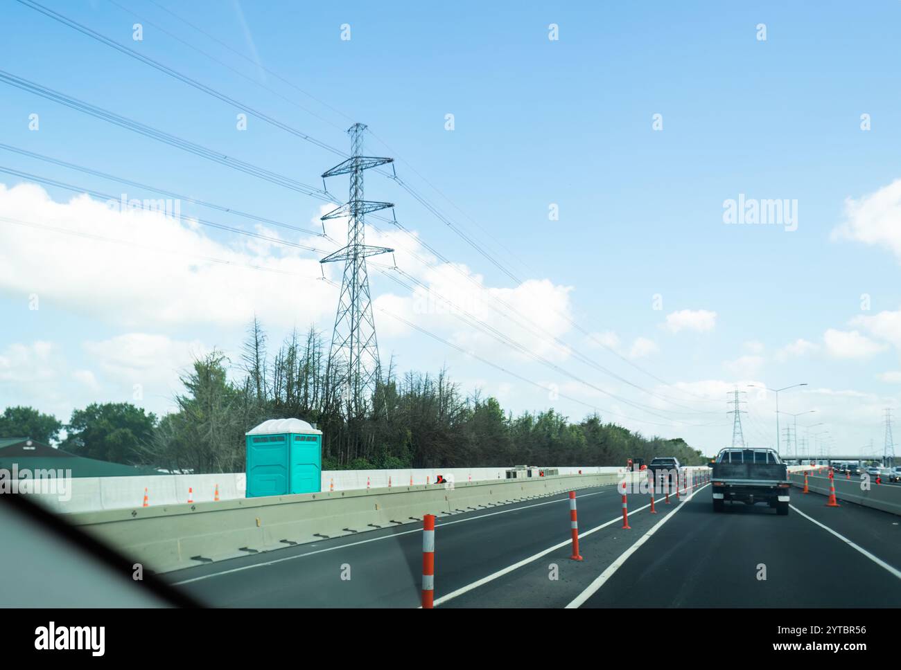 Portaloo on a blocked lane of highway for maintenance. Transmission ...